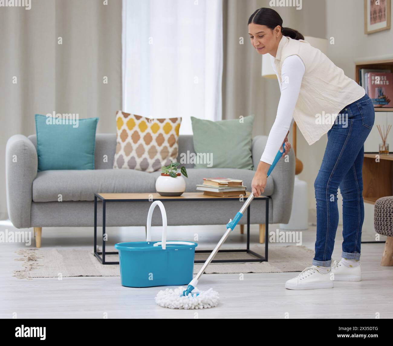 Woman, mop and smile on cleaning floor with home for hygiene ...