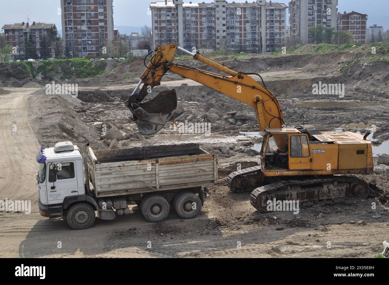 Bulldozer loads dump truck hi-res stock photography and images - Alamy