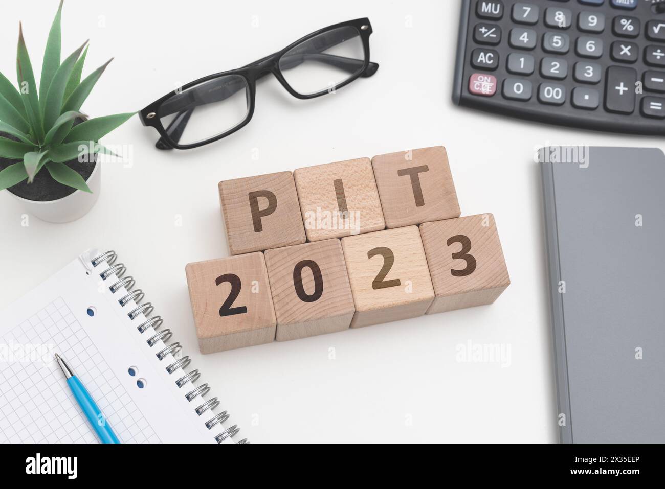 A wooden block with the word PIT 2023 means TAX in polish Stock Photo ...