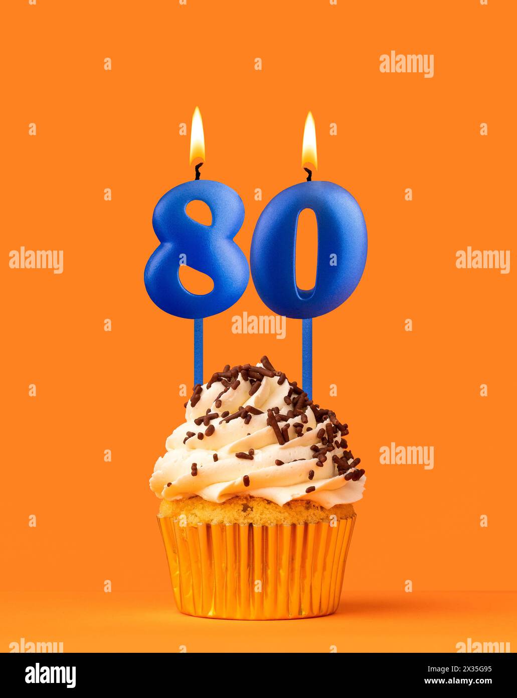 Blue birthday candle and cupcake - Number 80 Stock Photo - Alamy