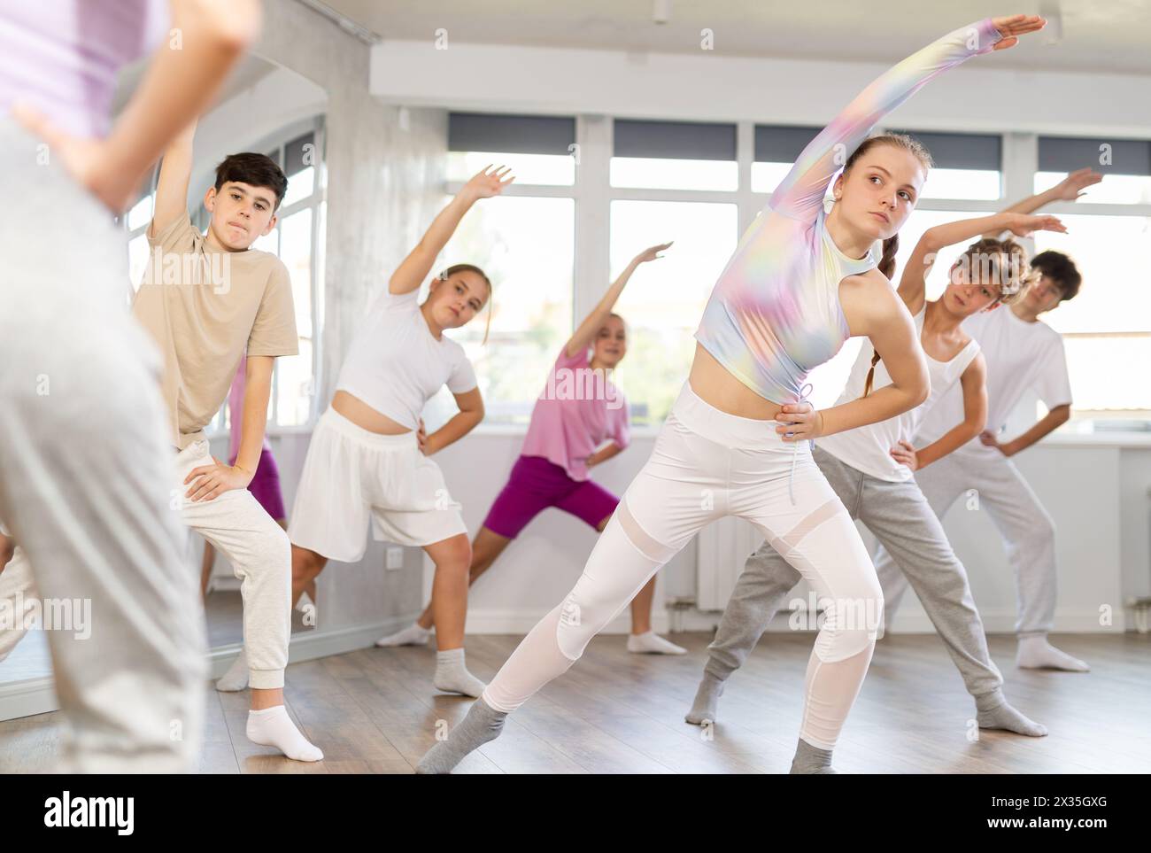 Group of children warming up before dance class Stock Photo - Alamy