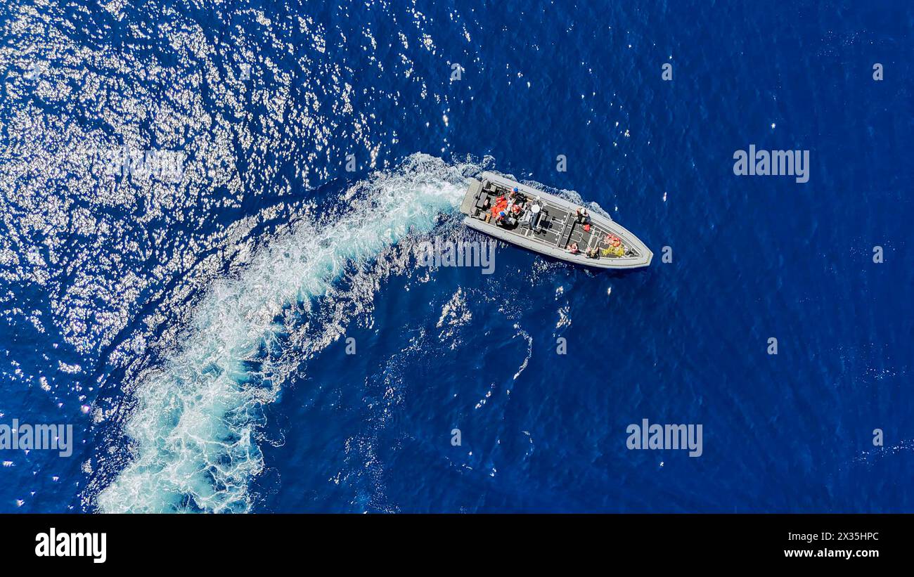 Sailors operate a 11-meter rigid-hulled inflatable boat (RHIB) during ...