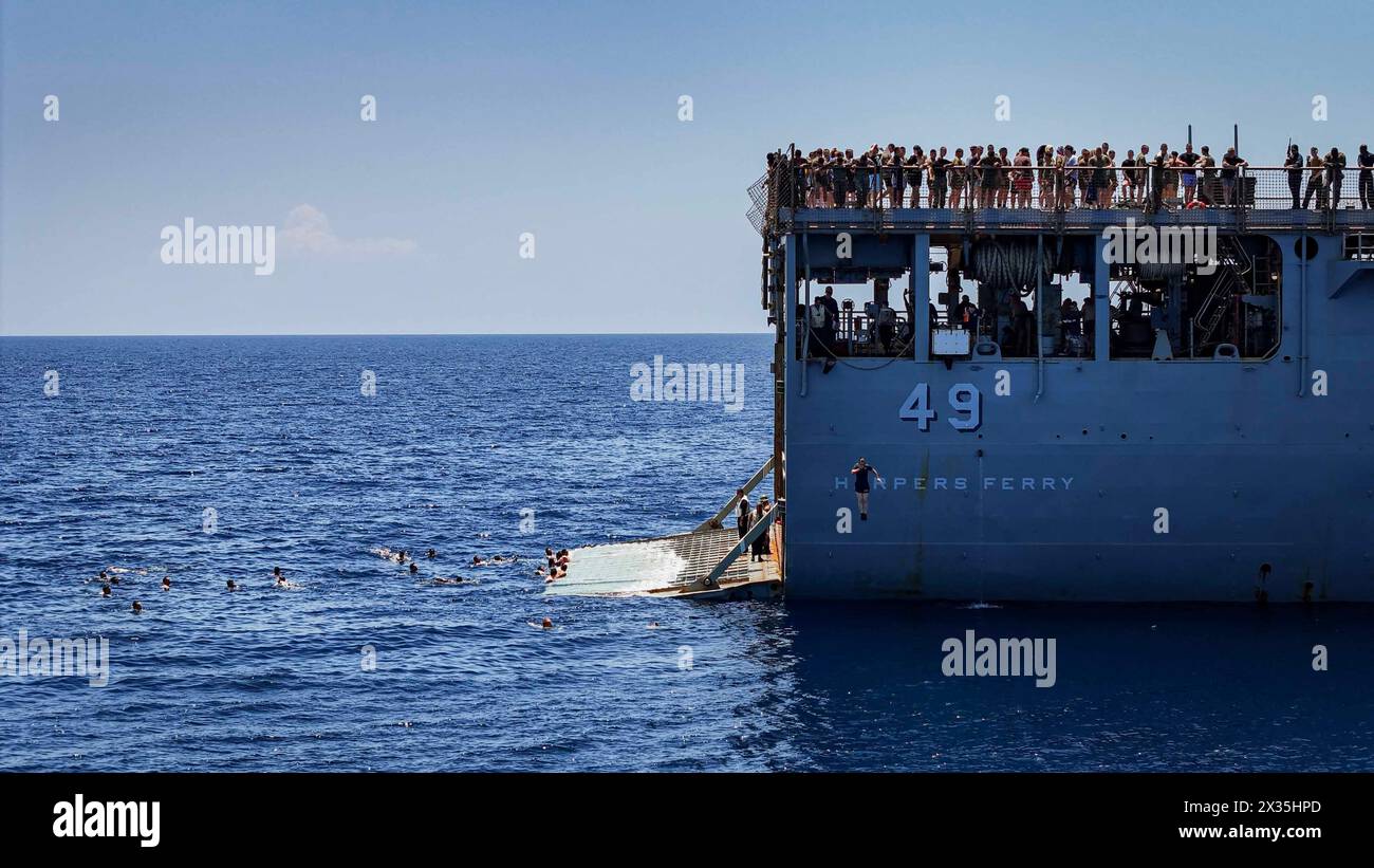 Sailors conduct a swim call from the aft starboard fantail of ...