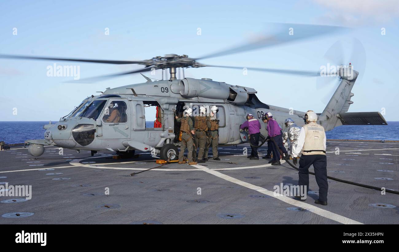Sailors refuel an SH-60S SeaHawk, attached to Helicopter Sea Combat ...