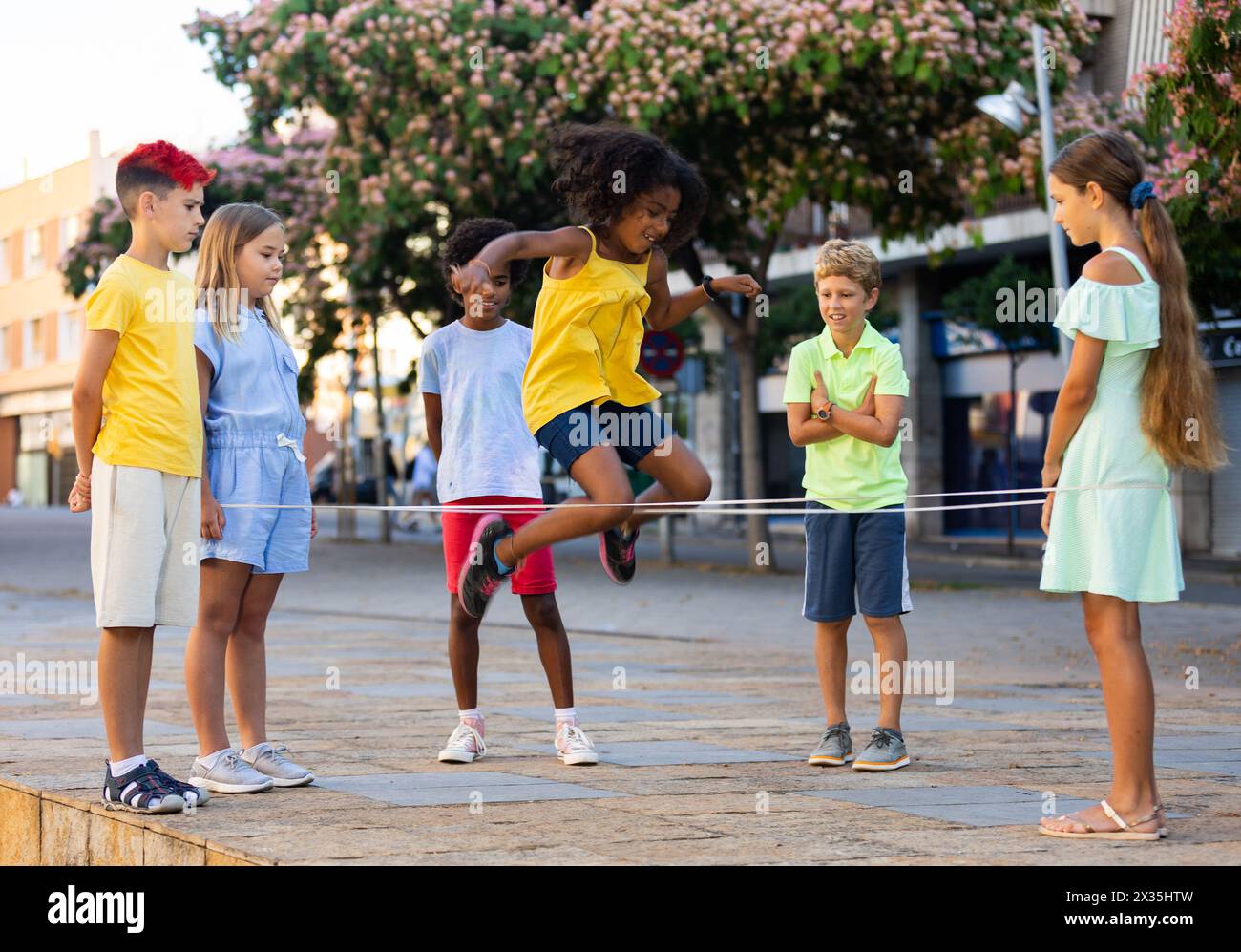 Kids playing together outdoors Stock Photo - Alamy