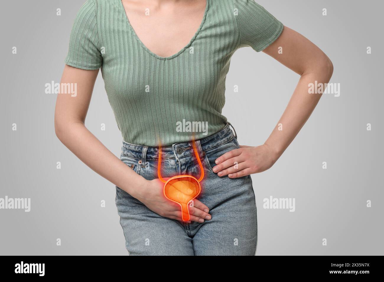 Woman suffering from cystitis on light grey background, closeup ...