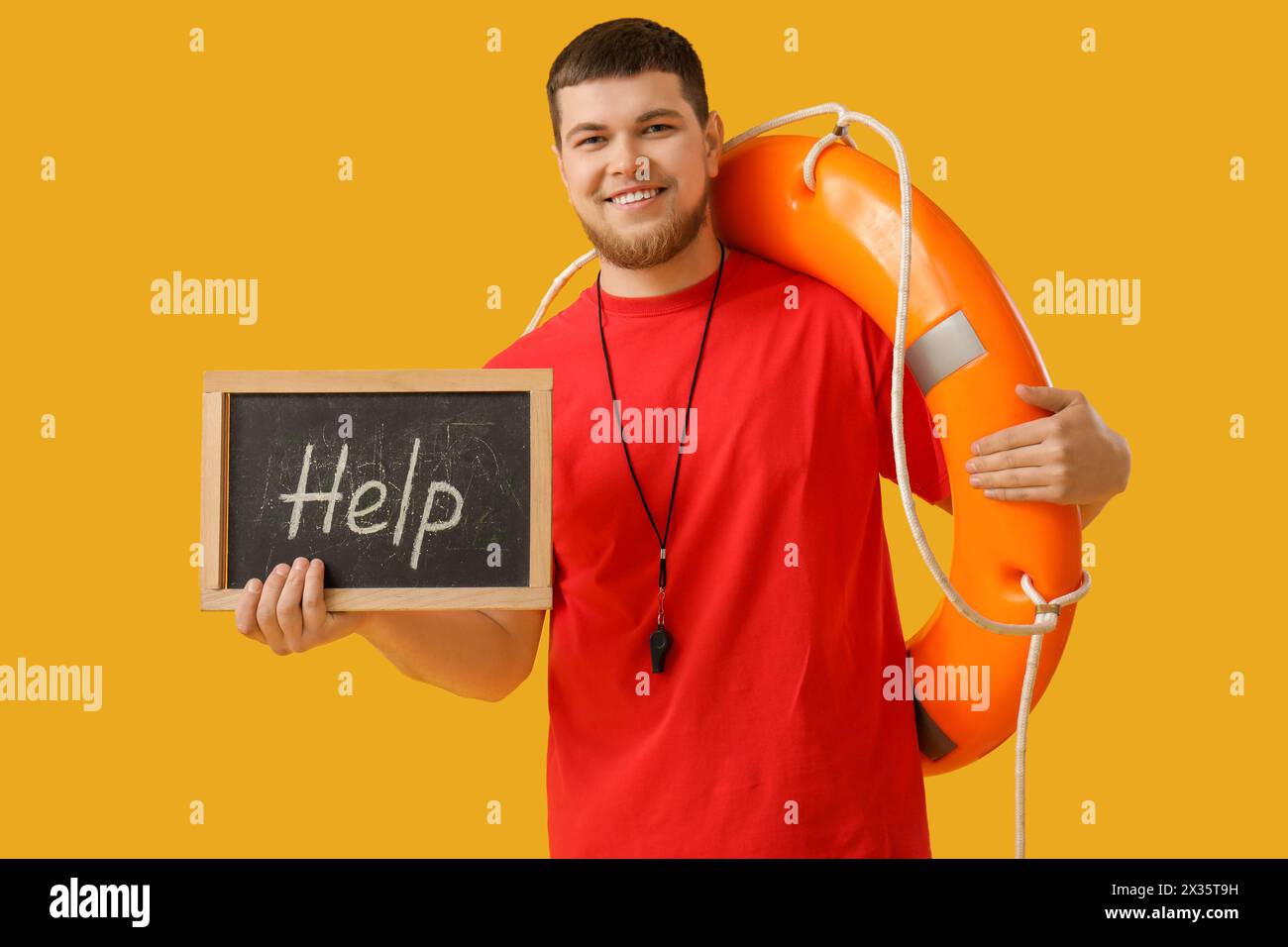 Red and yellow beach uniform hi-res stock photography and images - Alamy