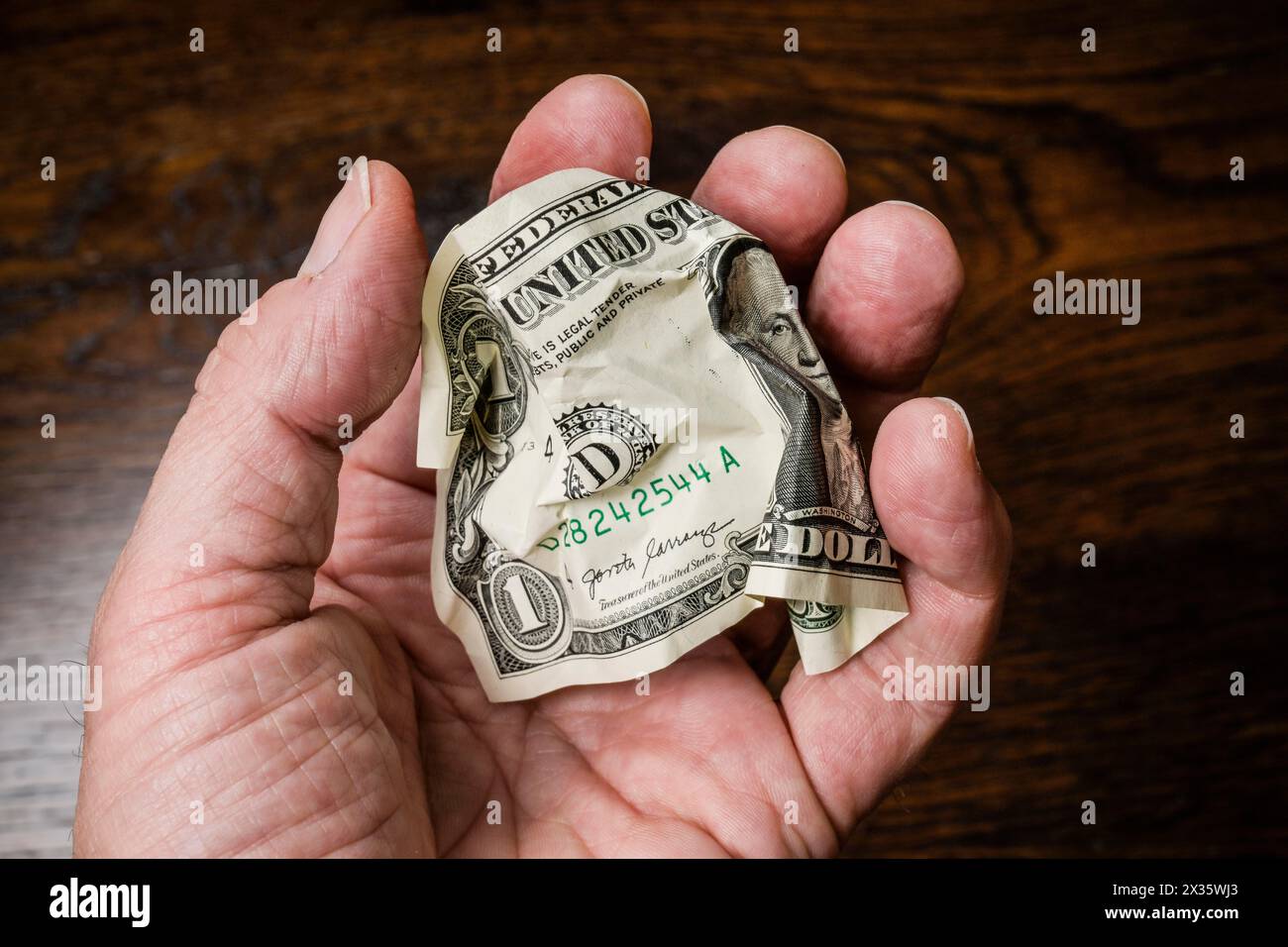 Symbol photo weak dollar, problem, crumpled note Stock Photo - Alamy