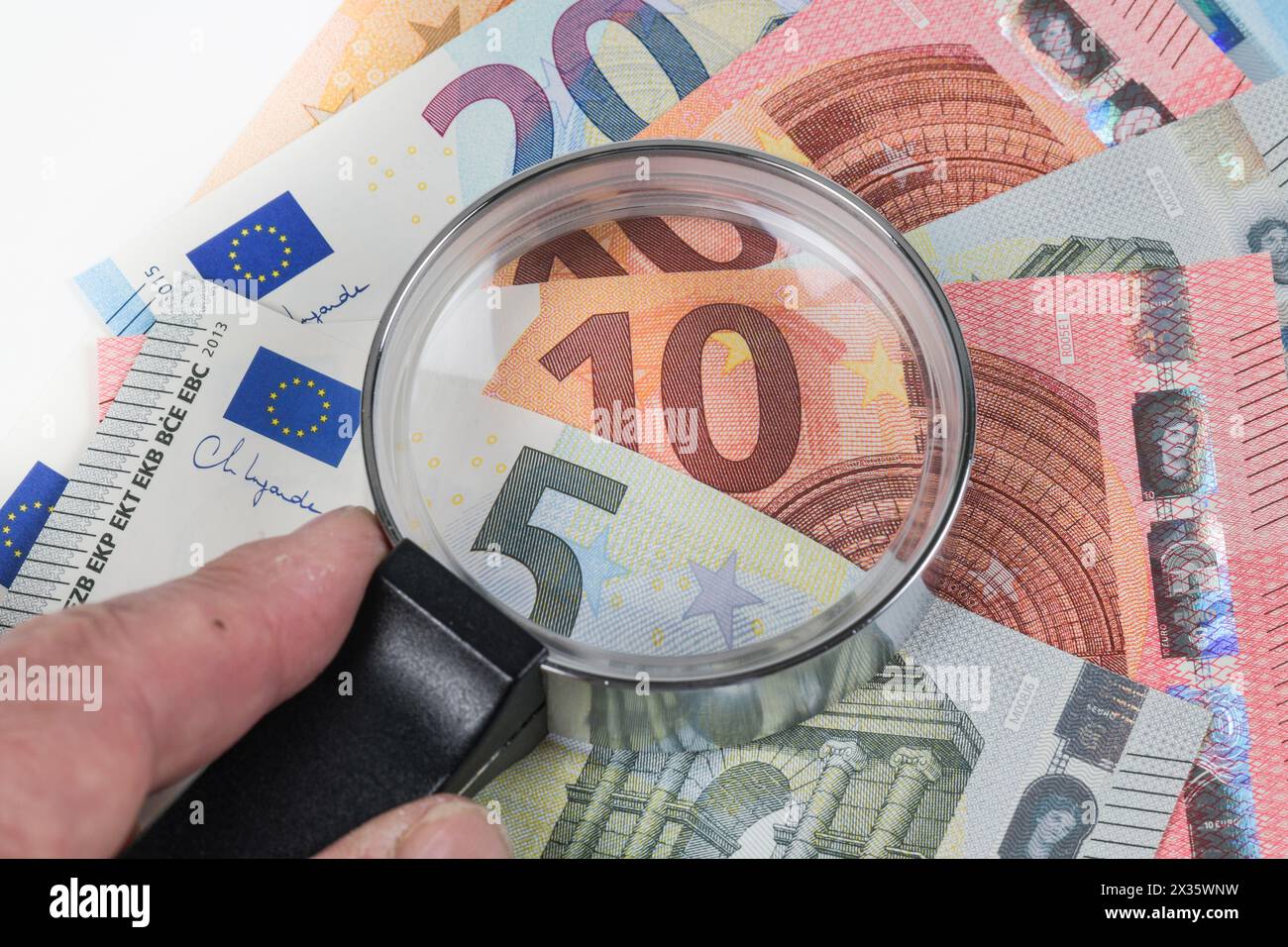 Symbol photo counterfeit money, magnifying glass, check, euro Stock ...