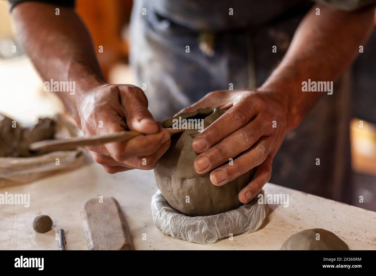 Man potter working clay figure hi-res stock photography and images - Alamy