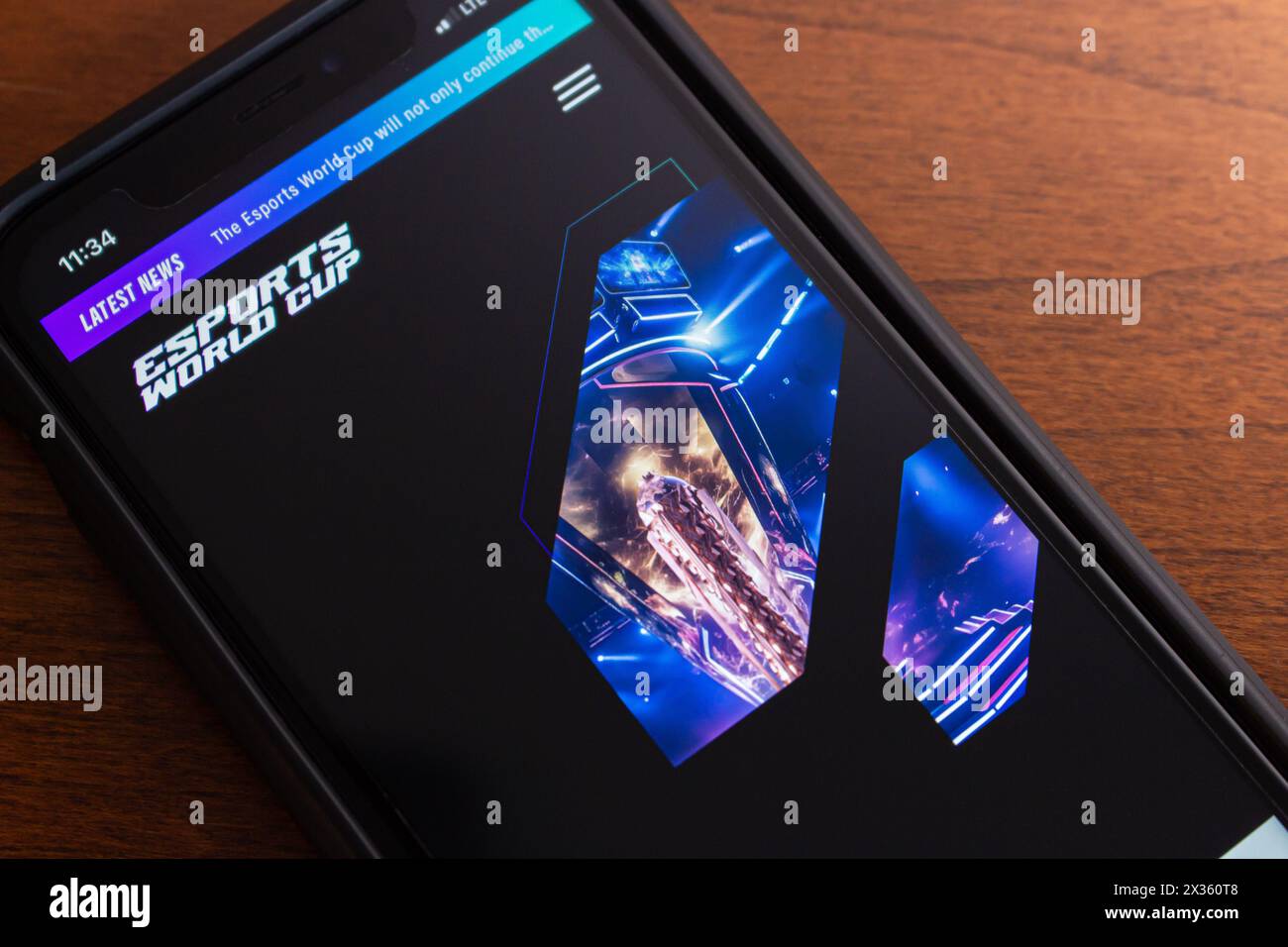 Website of 2024 Esports World Cup seen in an iPhone screen. EWC is an ...