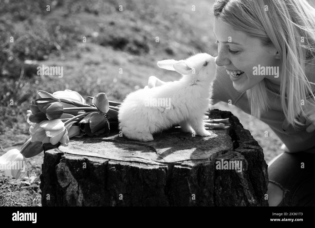 Lovely woman hold white rabbit. Beautiful young woman with bunny rabbit ...