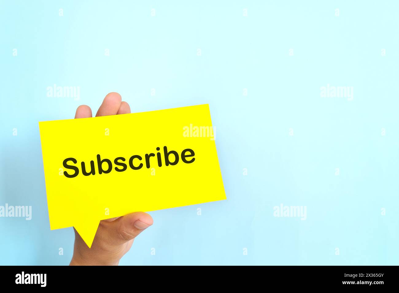 Human hand holding speech bubble with written word Subscribe Now Stock ...