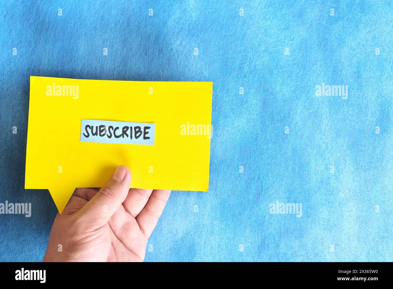 Human hand holding speech bubble with written word Subscribe Now Stock ...