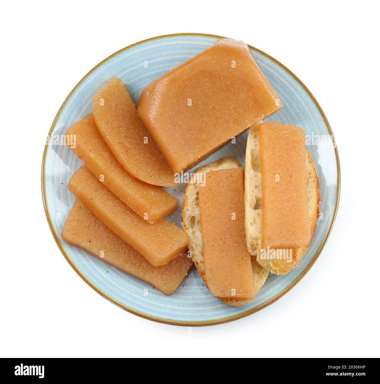 Delicious sweet quince paste and bread isolated on white, top view ...