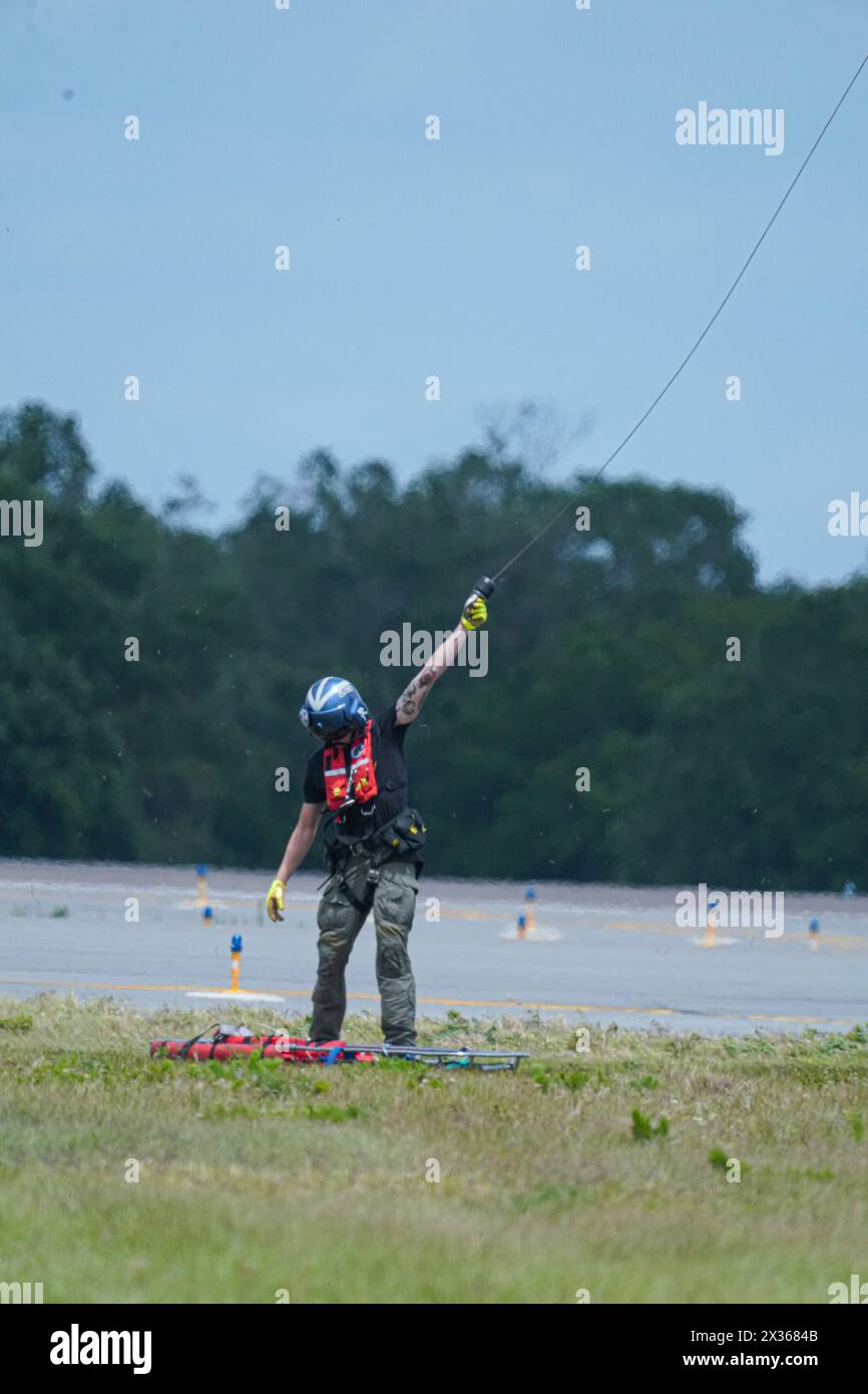 Sanford, Florida, USA, April 21, 2024, US Coast Guard Rescue swimmer demonstrating a save During ...