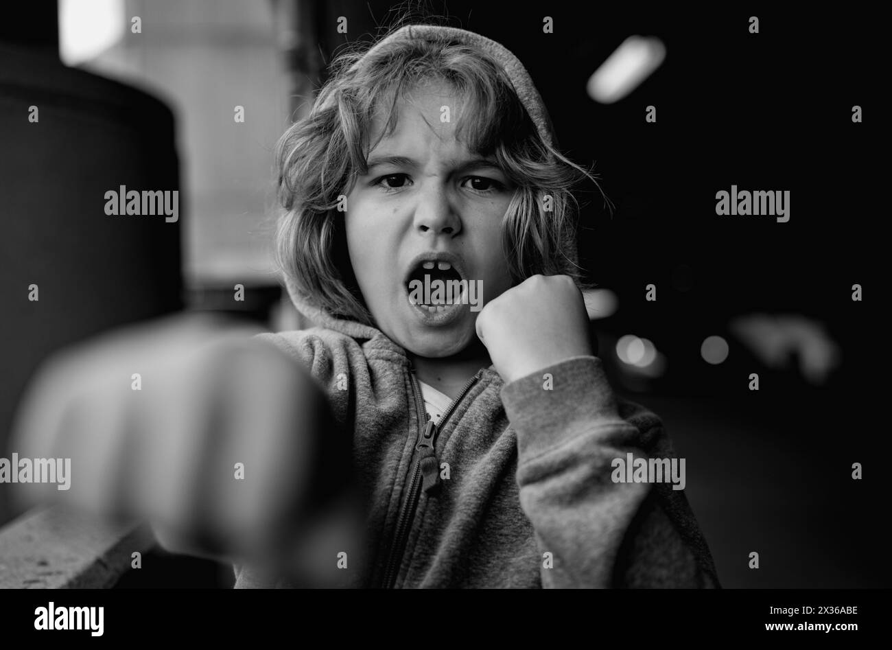 Aggressive child. Aggression kid boy fighting on street. Angry ...