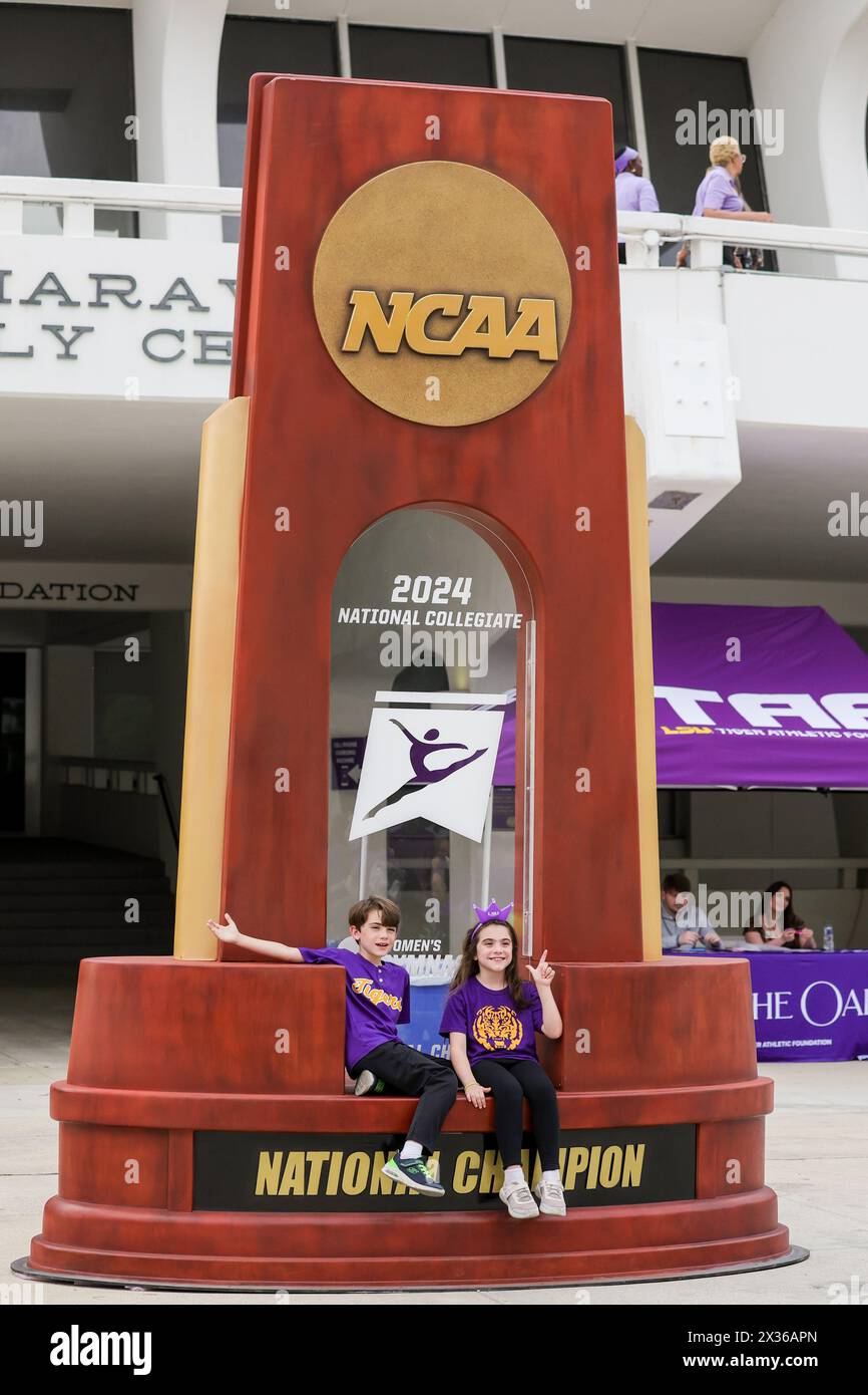 Baton Rouge, LA, USA. 24th Apr, 2024. Some young fans pose with a large ...