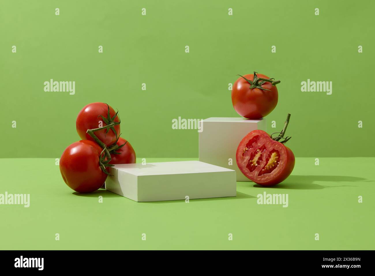 Square shaped podiums decorated with some fresh tomatoes. Mock-up for ...