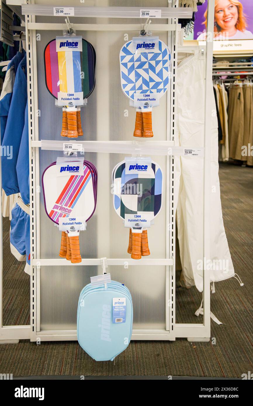 Various colorfully patterneds Prince pickleball paddles at a display at ...