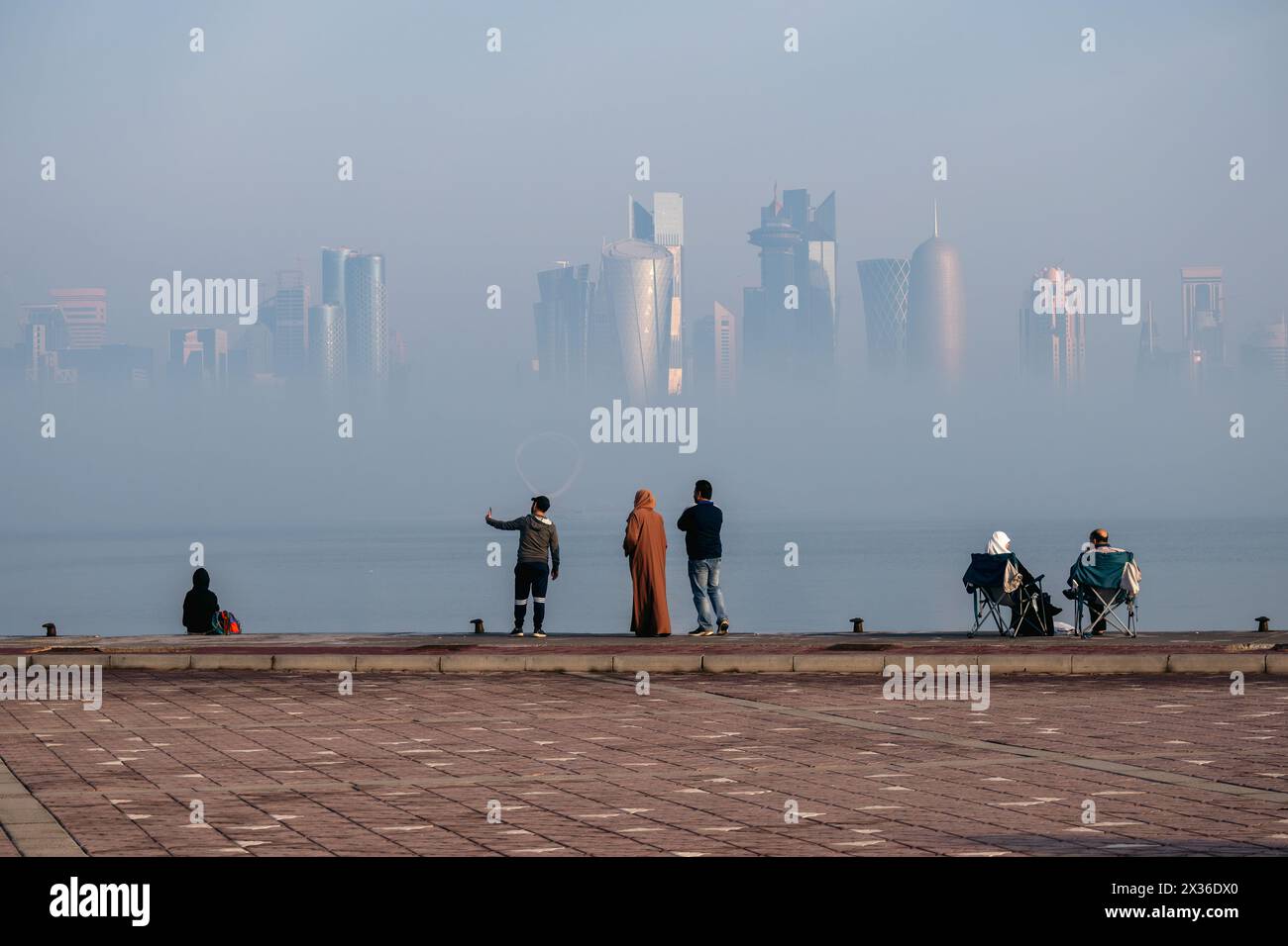 Doha skyline in fog hi-res stock photography and images - Alamy
