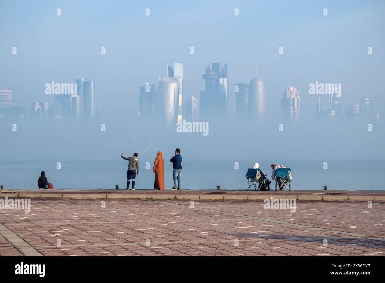 Foggy Doha Corniche early morning winter days. Doha Skyline in Fog ...