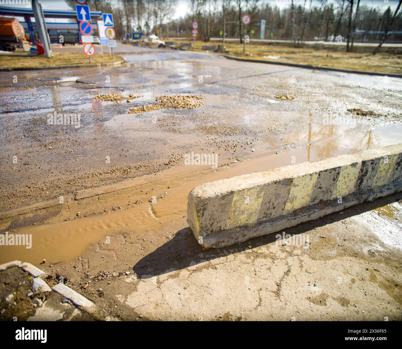 potholes and bumps on the road Stock Photo - Alamy