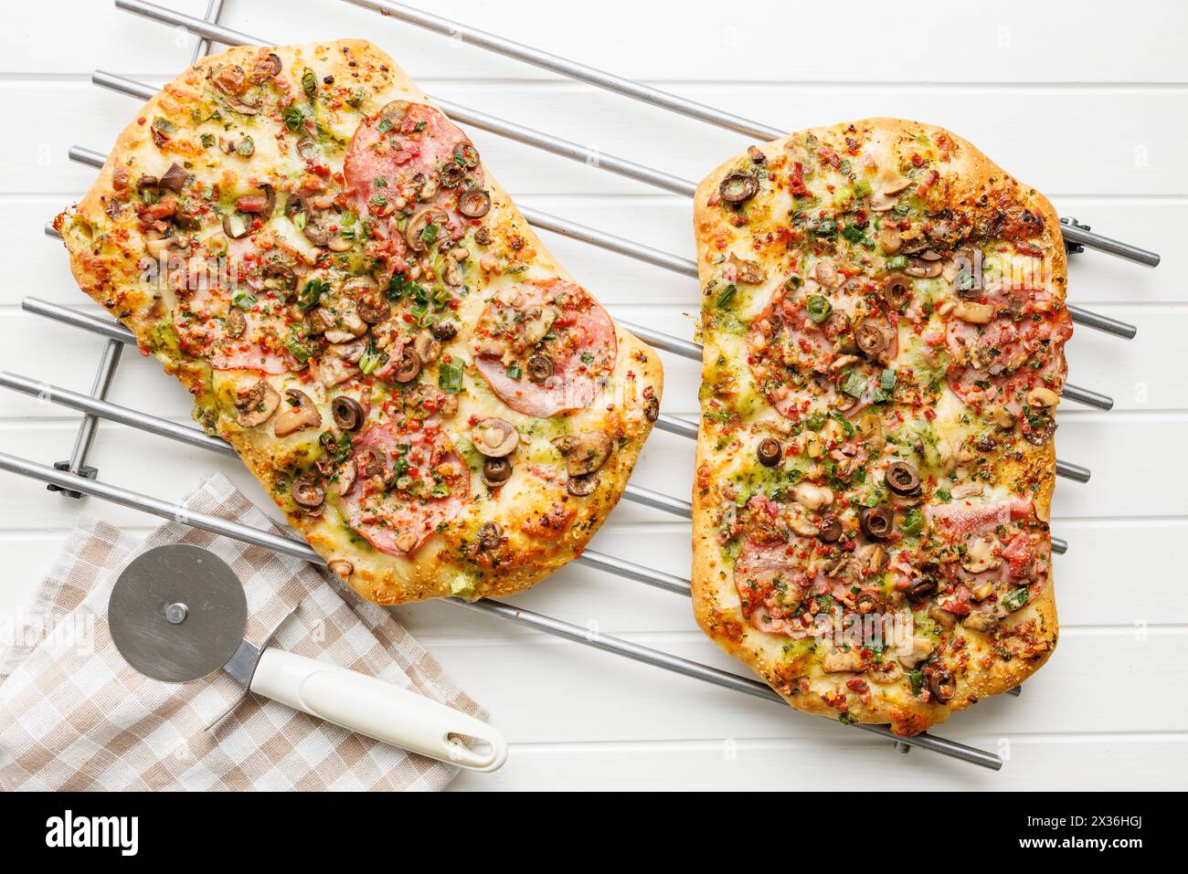 Tasty italian square pizza on a kitchen table. Top view Stock Photo - Alamy