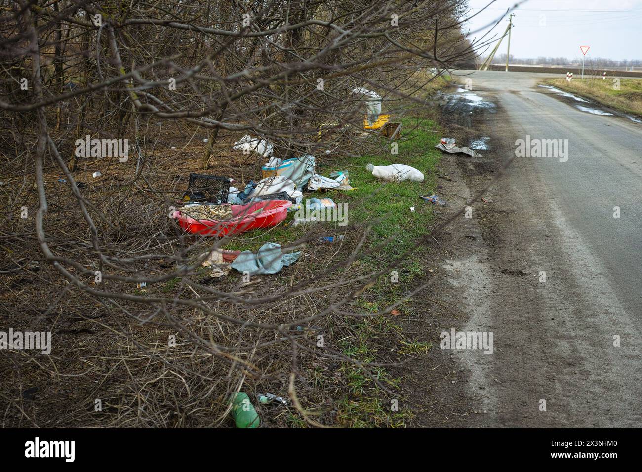 a trash scattered on the sidewalk of the road, outdoor shot Stock Photo ...