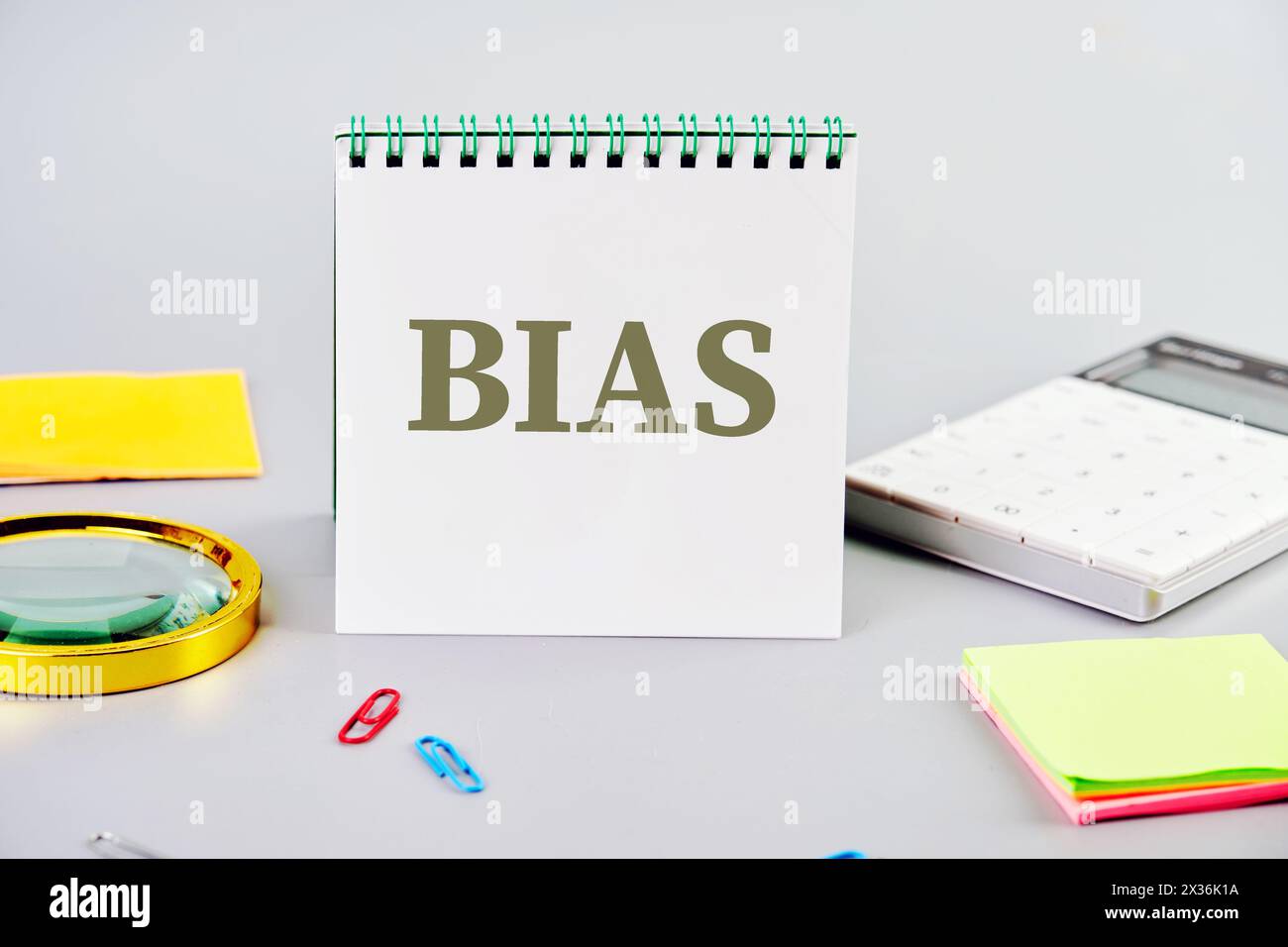 Concept of facts and biases. A word BIAS written on a notepad on a gray ...
