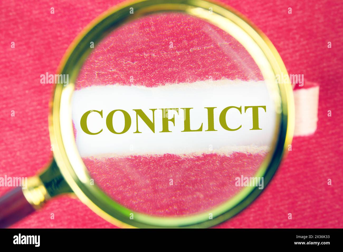 Business and finance concept. A word CONFLICT through a magnifying ...