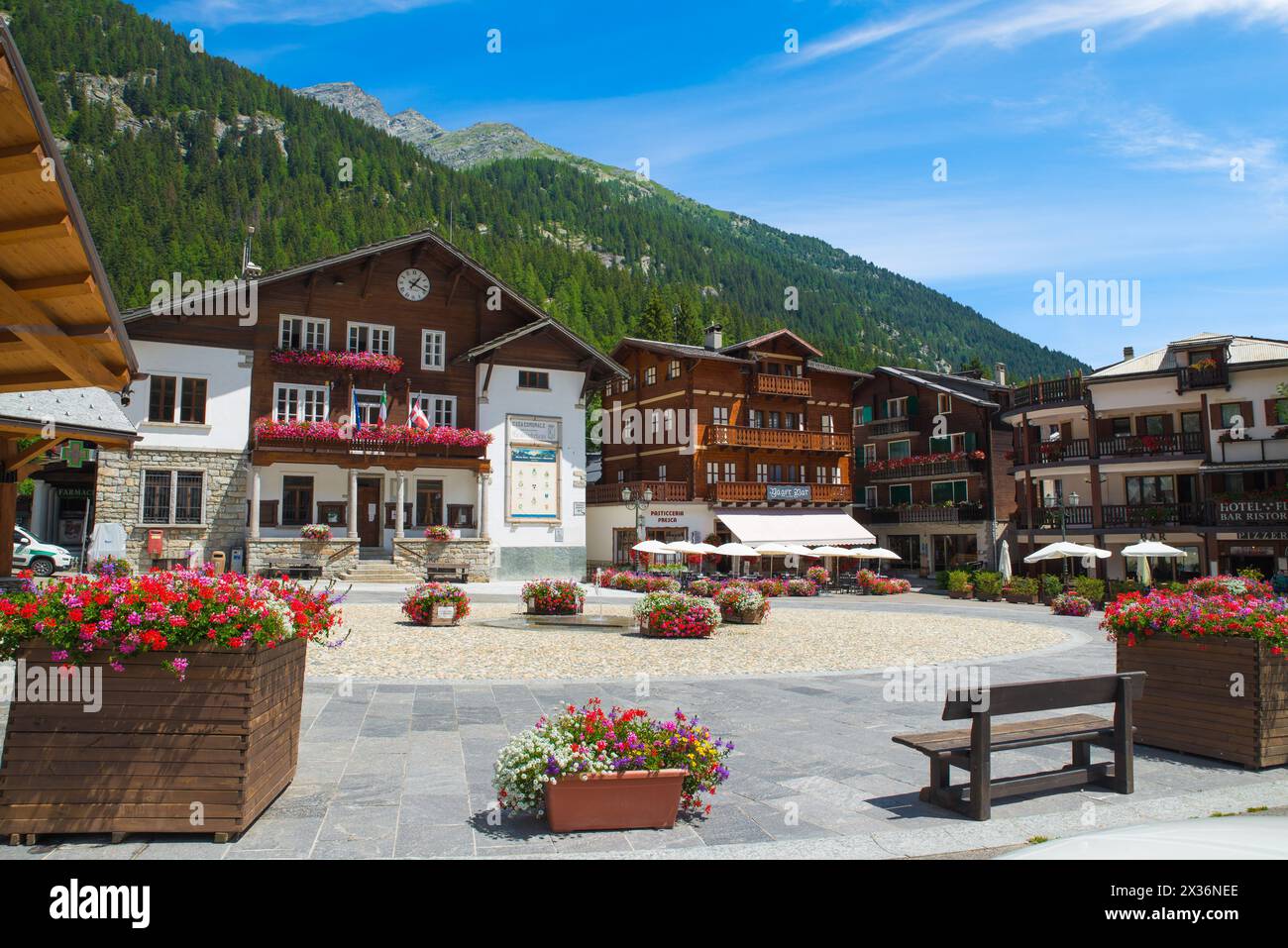 Macugnaga, Italy. Town hall in a typical square of a mountain village ...