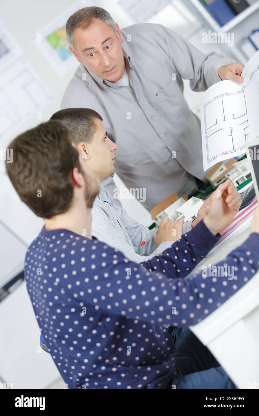 two male skilled team leaders talking together Stock Photo - Alamy