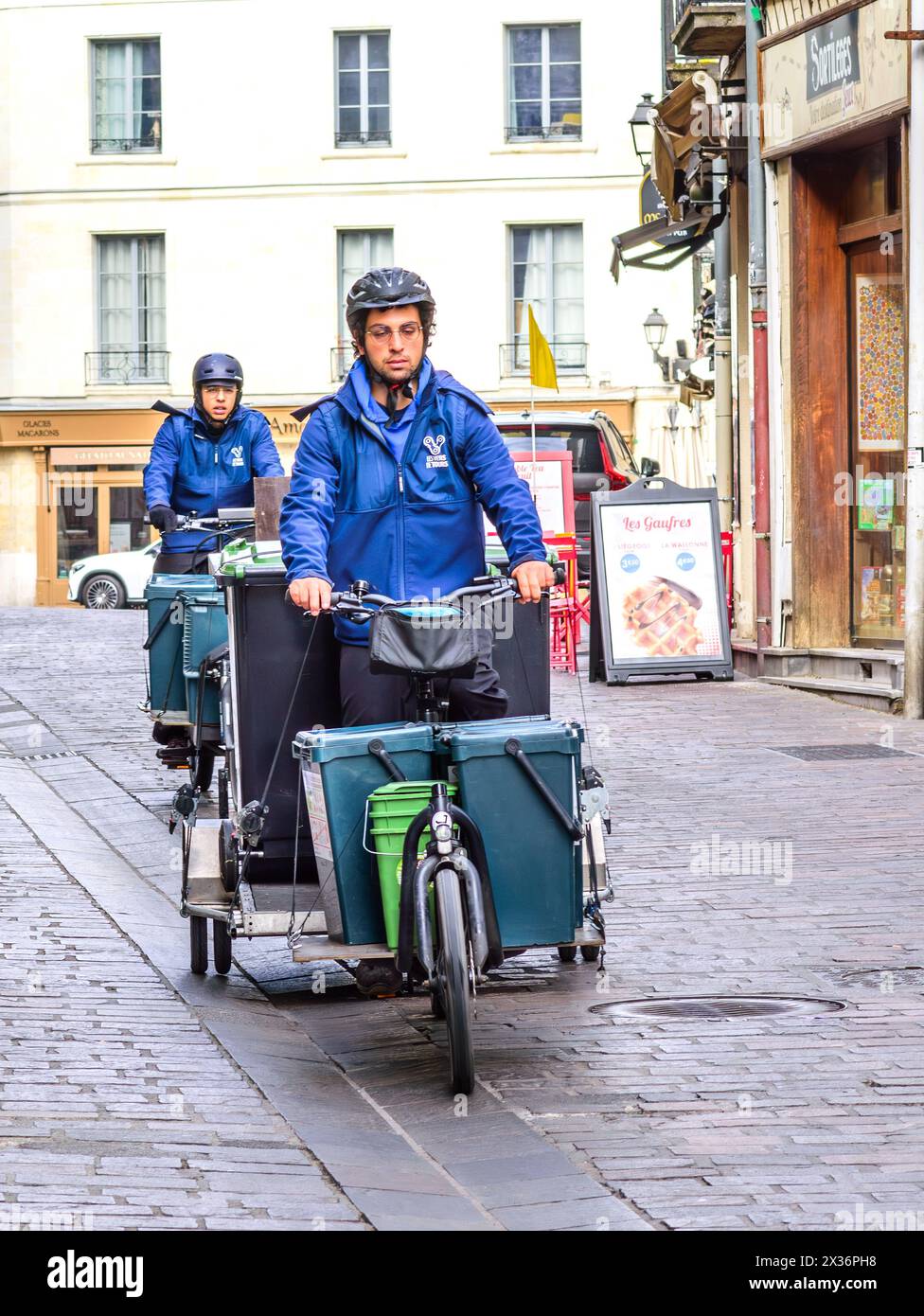 Men working for "Les Vers de Tours" on cargo bikes fitted with bins to ...
