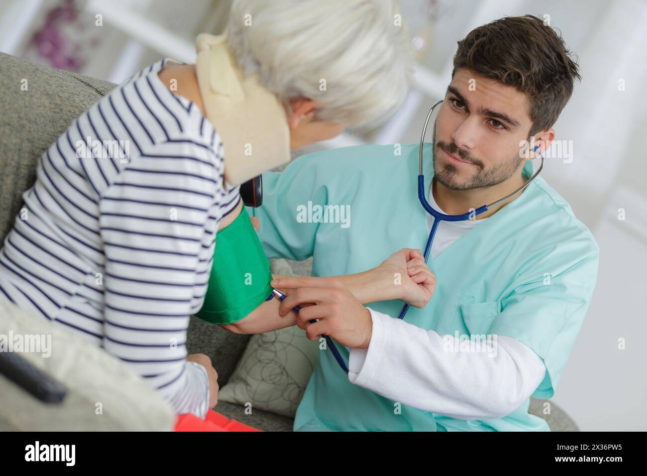 Caregiver smiling measuring blood hi-res stock photography and images ...