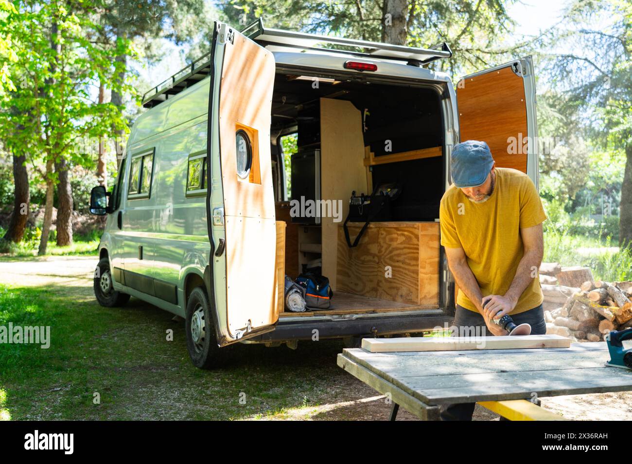 Man working camperizing a camper van Stock Photo - Alamy