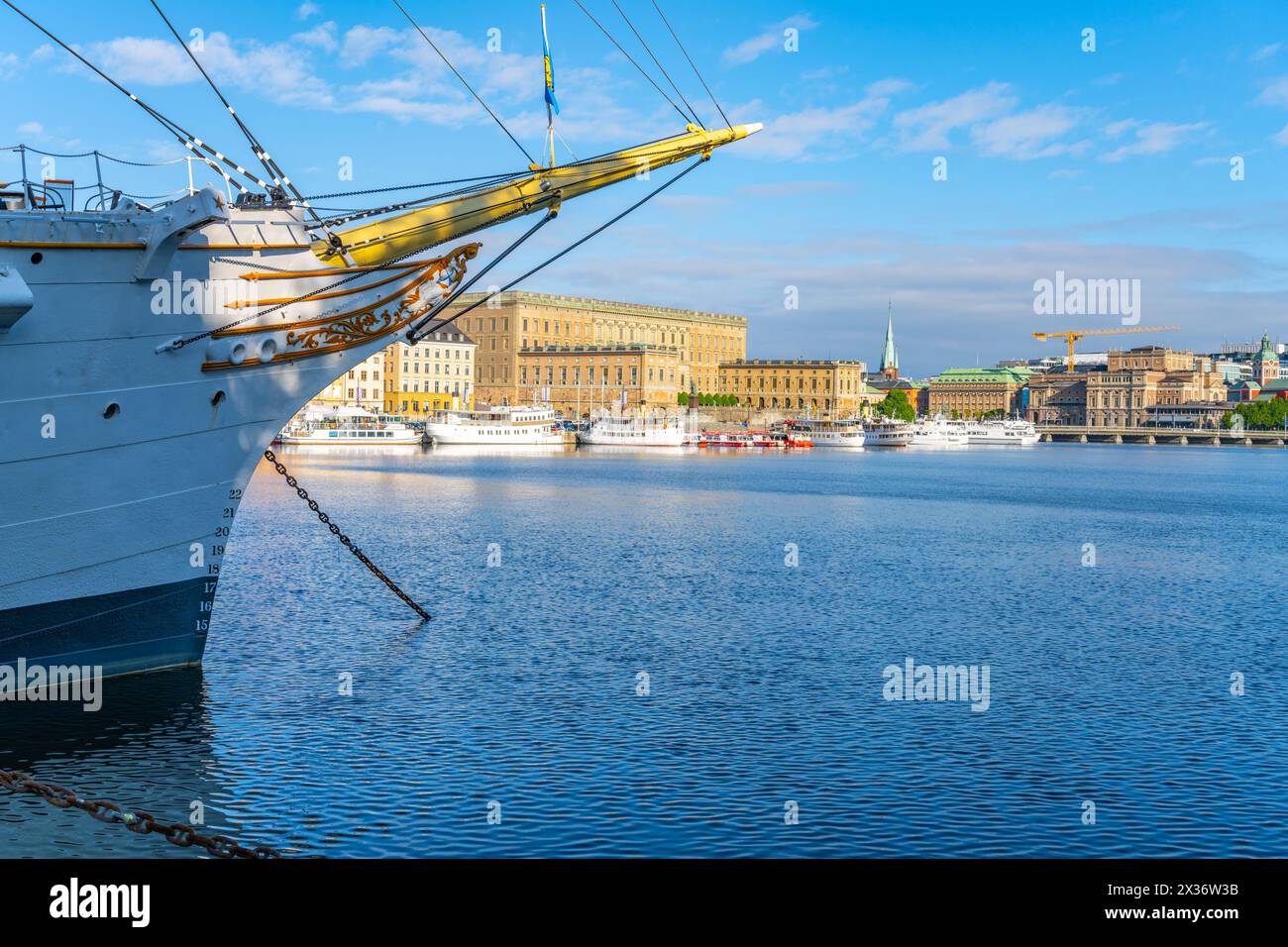 The Historic Af Chapman A Full Rigged Ship Is Moored In Stockholm Harbor With City Buildings