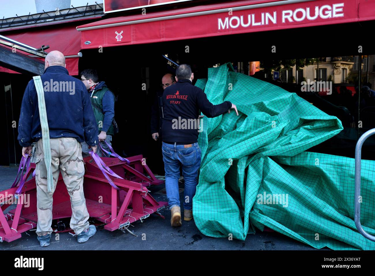Wings of the famous Moulin Rouge of Montmartre fell down the street ...