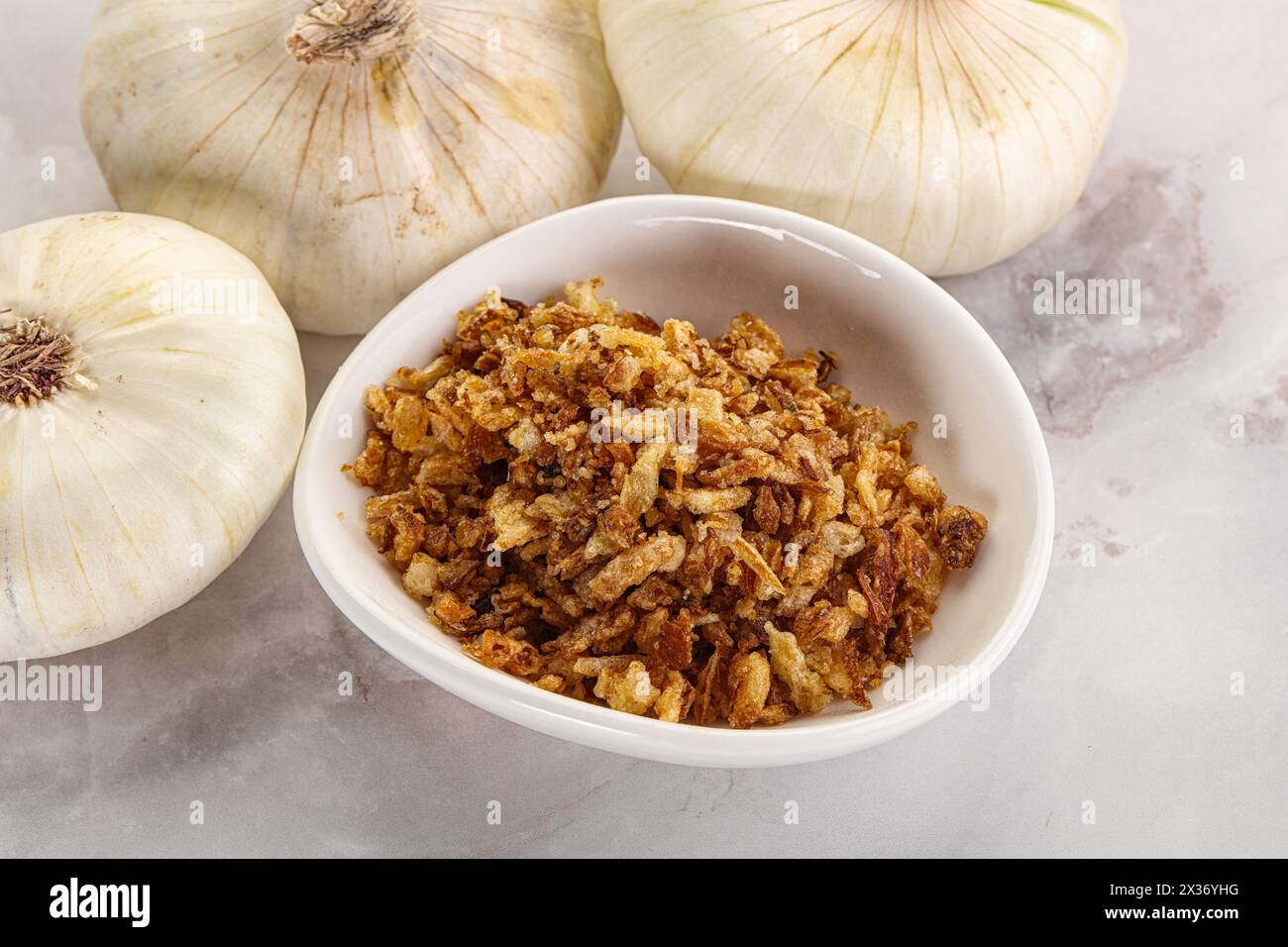 Dried roasted onion crunchy flakes for culinary Stock Photo - Alamy