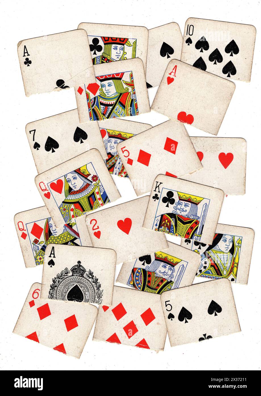 A montage of vintage playing cards torn in half on a white background ...