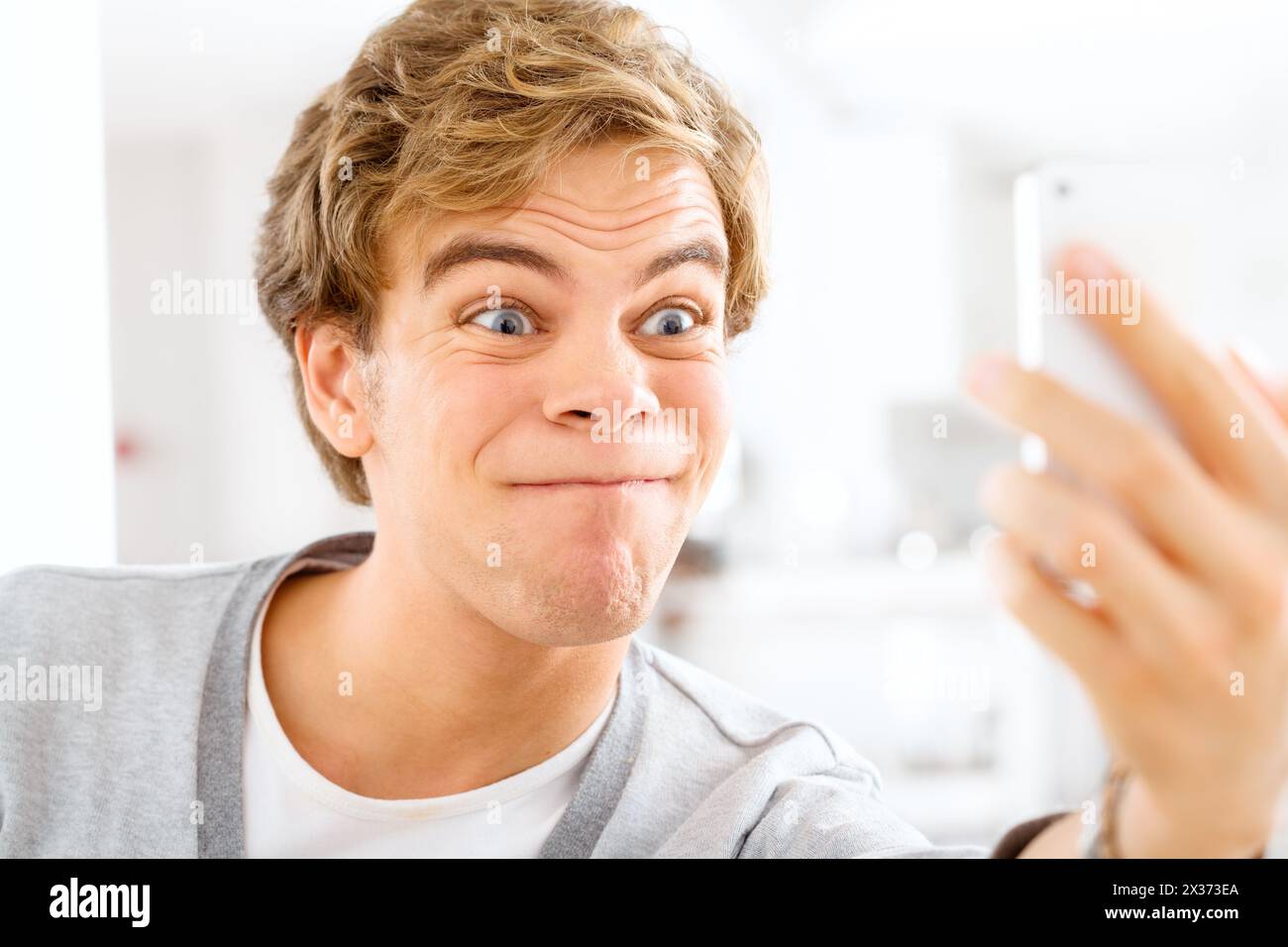 Crazy, selfie and man online with funny post to social media, website ...