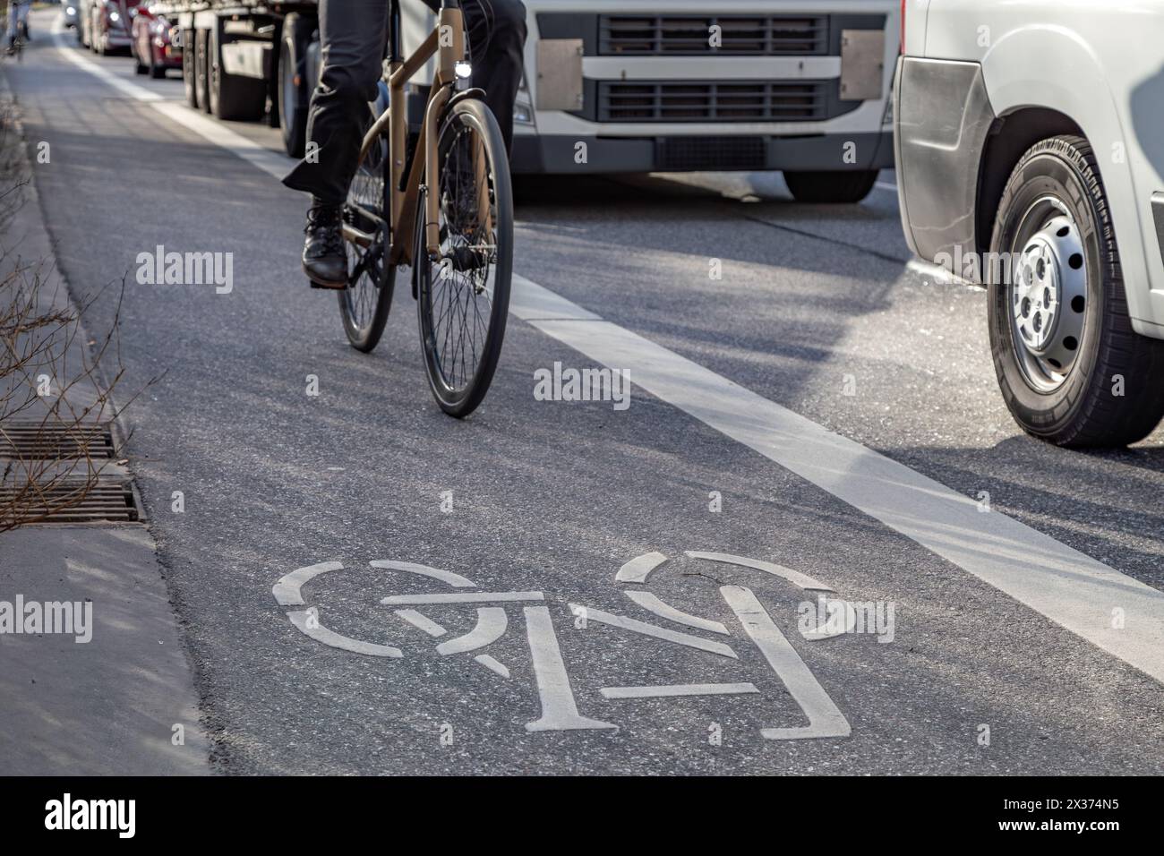 Car, cyclist and lorry hi-res stock photography and images - Alamy