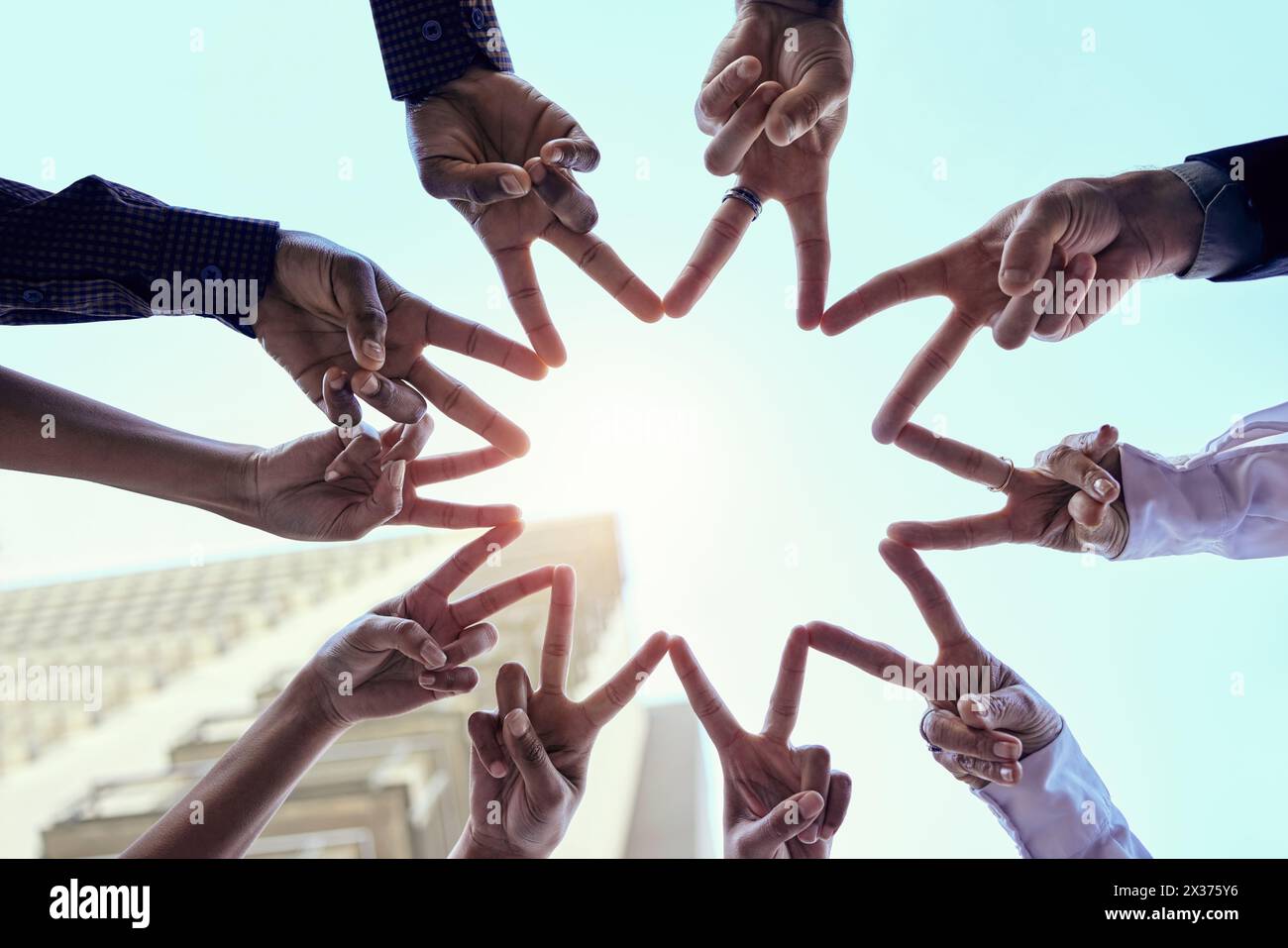 Teamwork, peace sign or trust with hands in circle for support ...