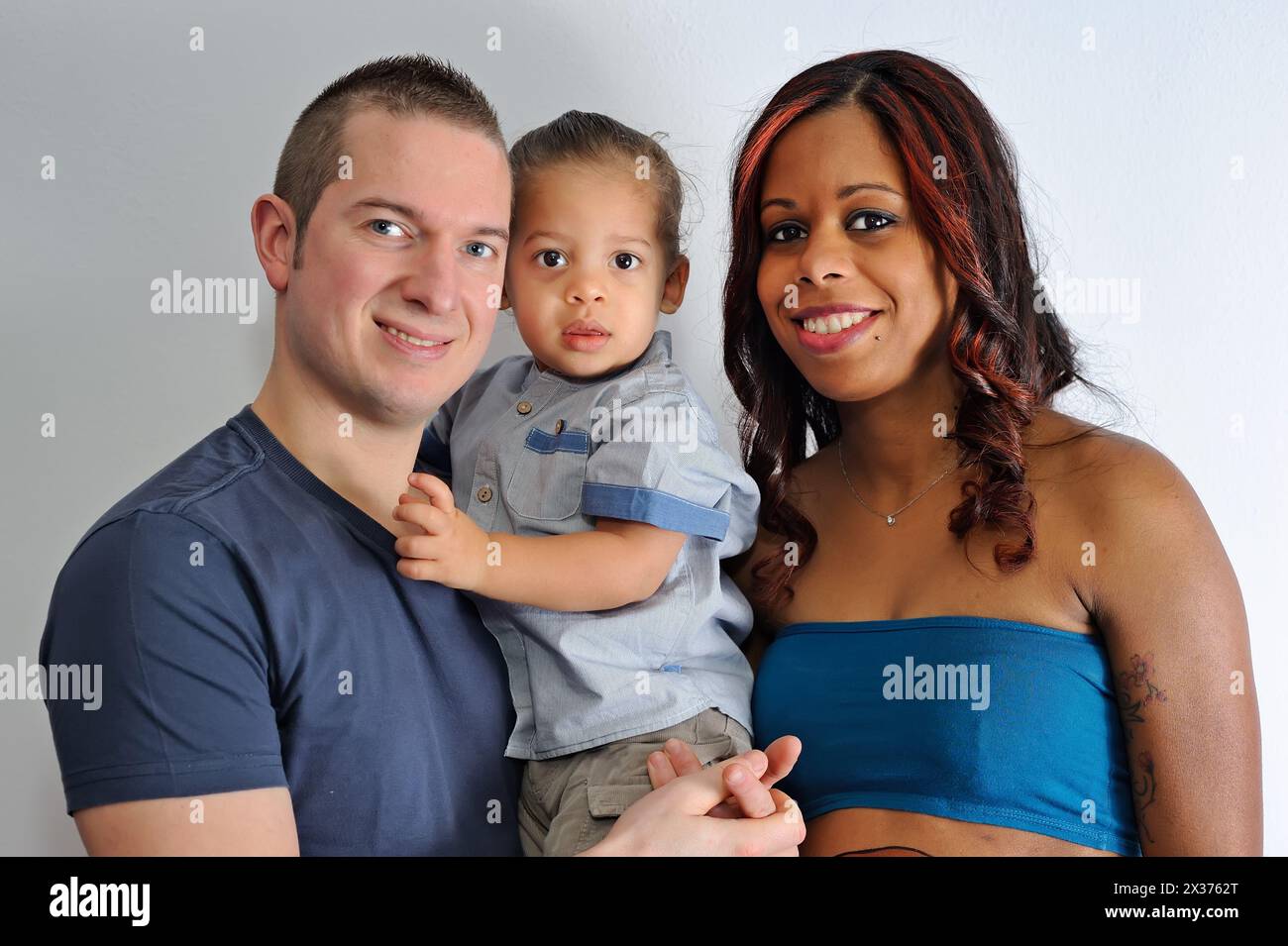 Beautiful multiethnic family consisting of a Caucasian father ...