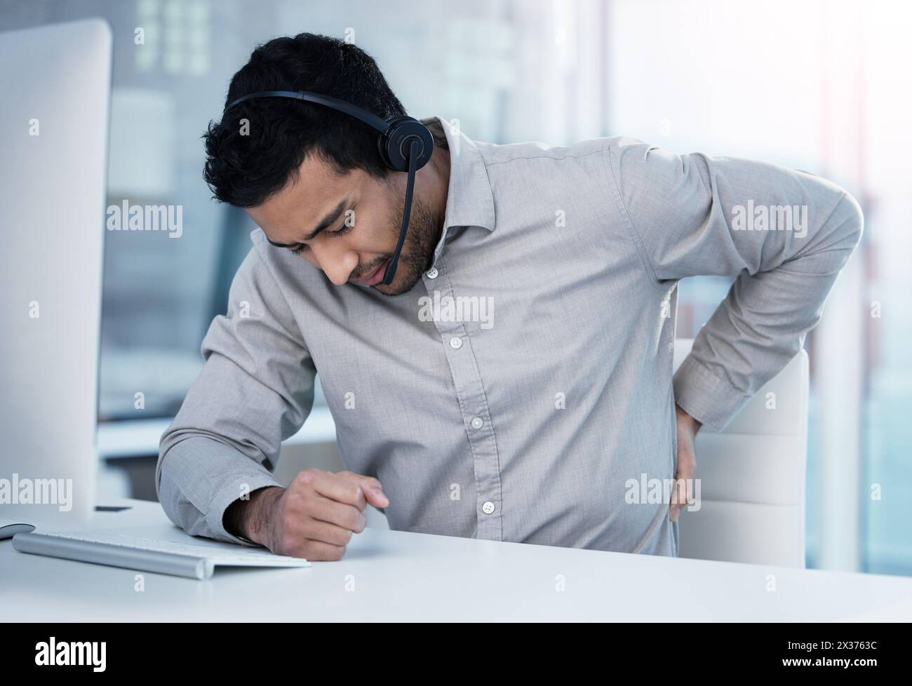 Call center agent, stress and back pain with muscle strain for burnout ...