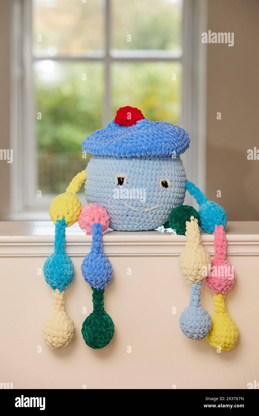 Cute knitted toy at home in the kitchen Stock Photo - Alamy