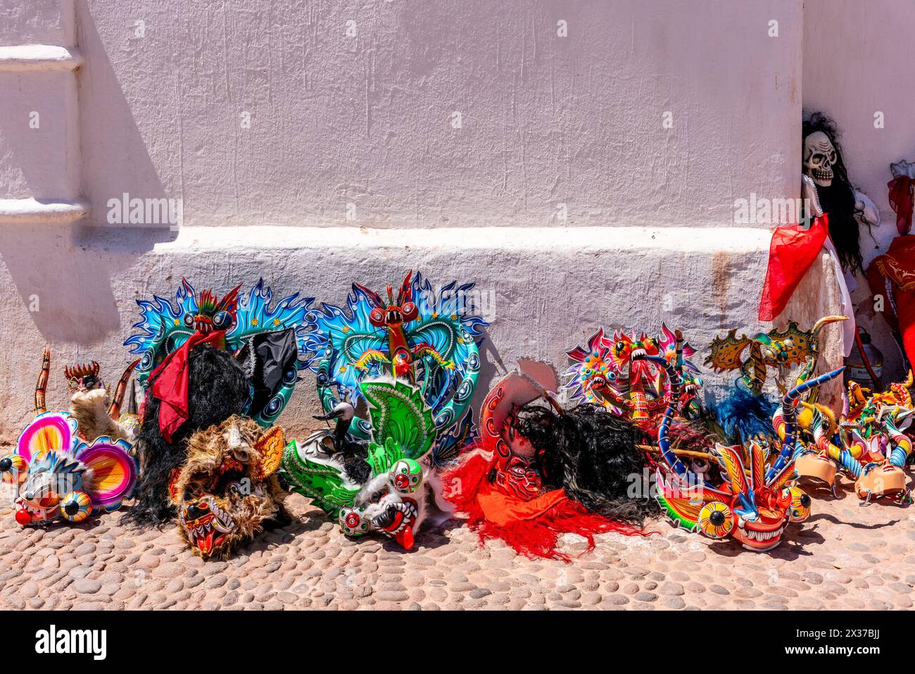 Carnival Masks Lined Up Against A Church Wall During La Fiesta de la ...