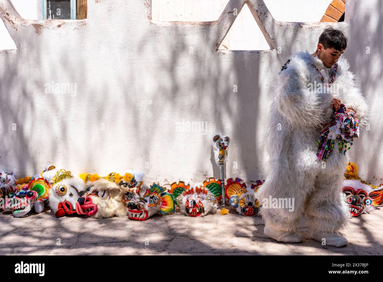 Carnival Masks Lined Up Against A Church Wall During La Fiesta de la ...