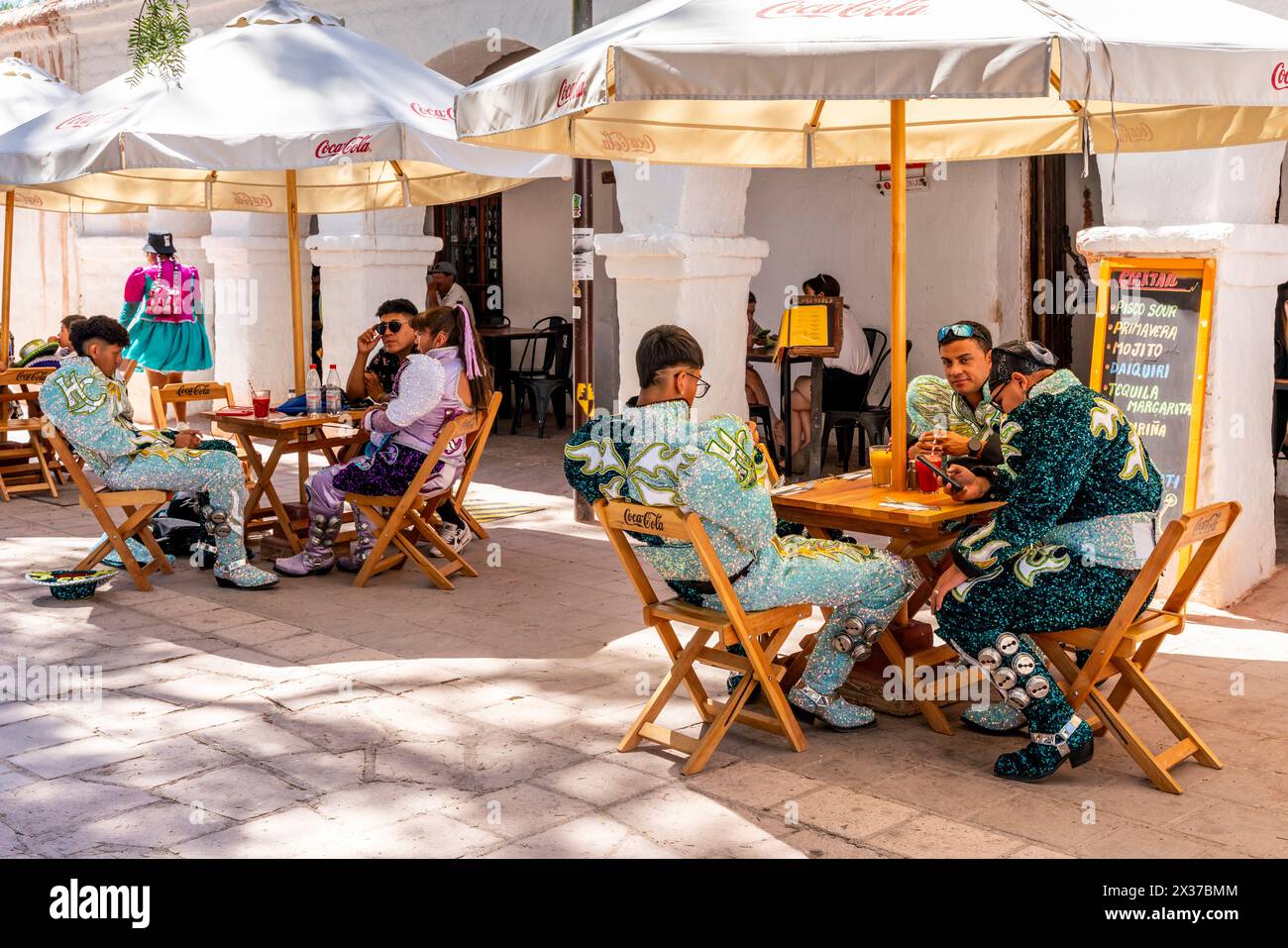 Revellers Sitting Down At A Cafe During La Fiesta de la Virgen de la ...