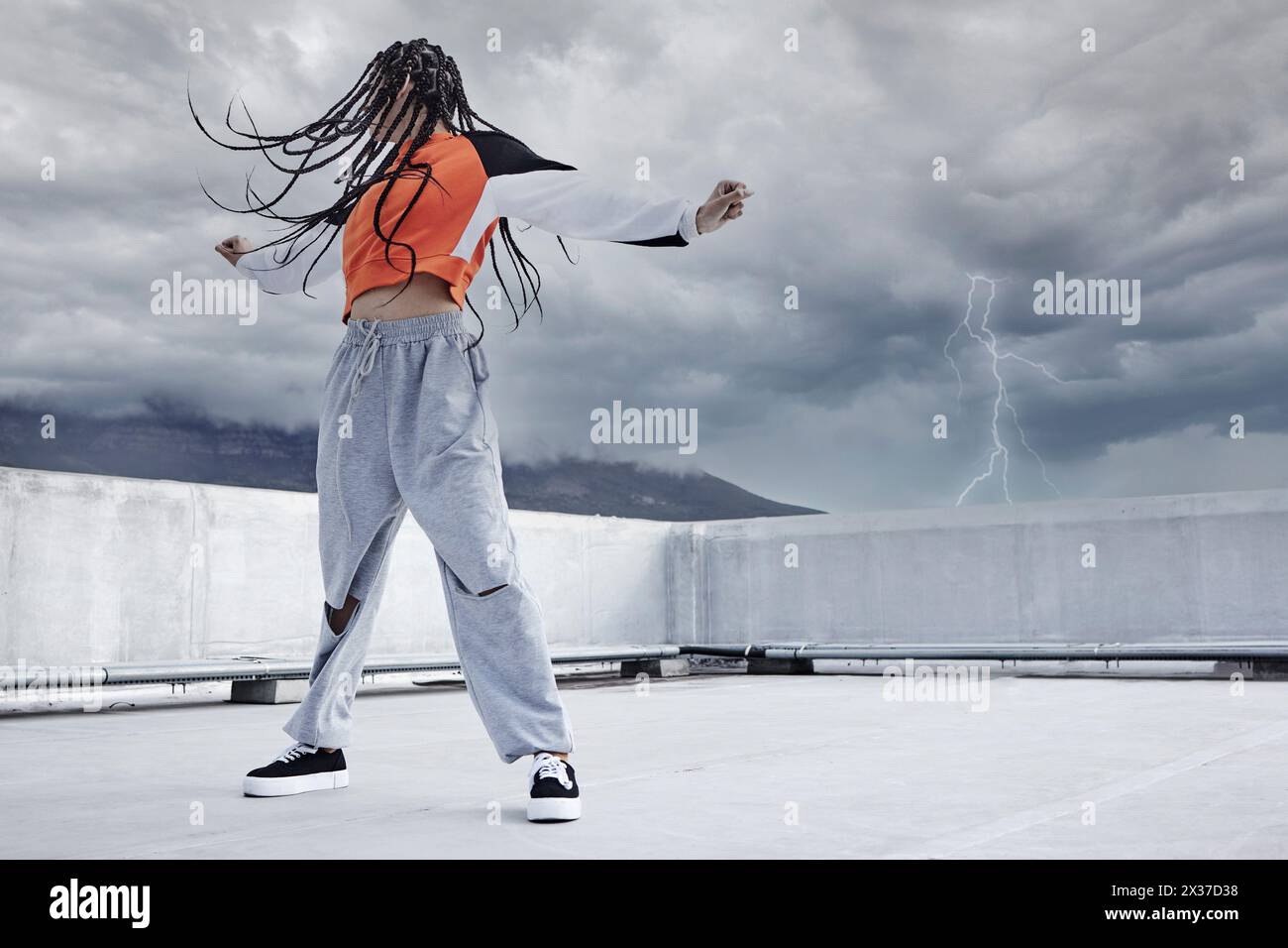 Girl, dance and hip hop outdoor on city rooftop with lightning storm ...